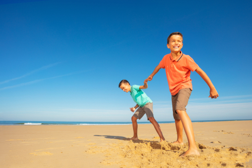 Two boys are pulling each other by holding hands as shown below-Turito